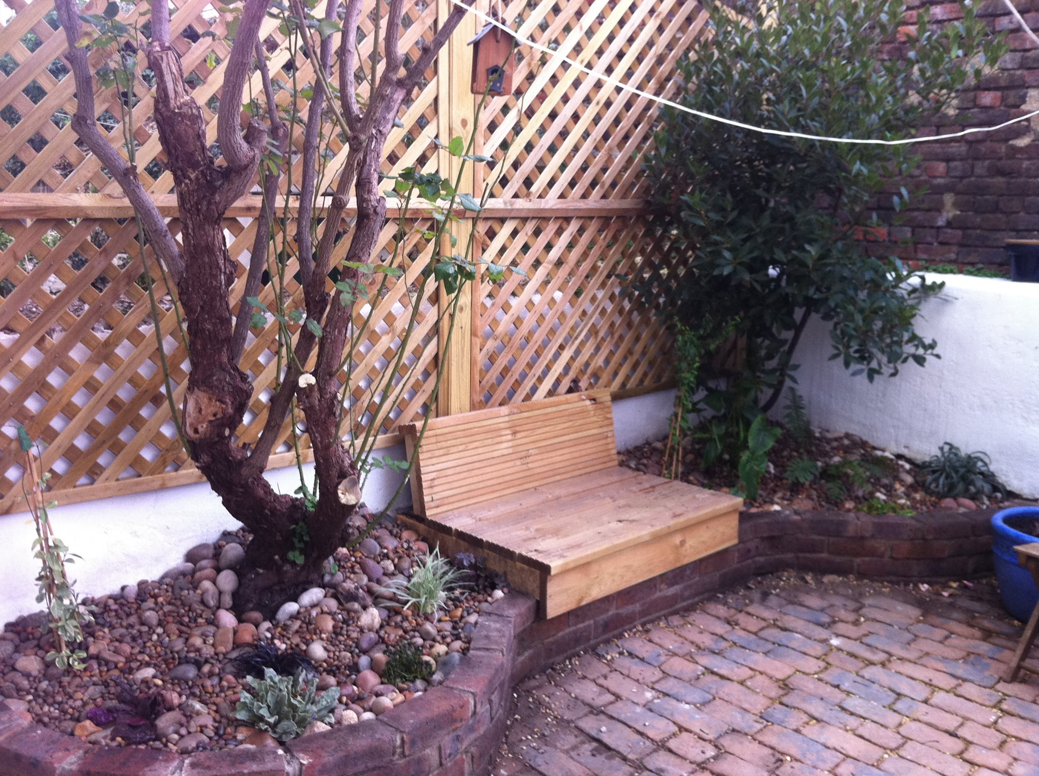Full garden makeover for a back garden including new paving, retaining ...